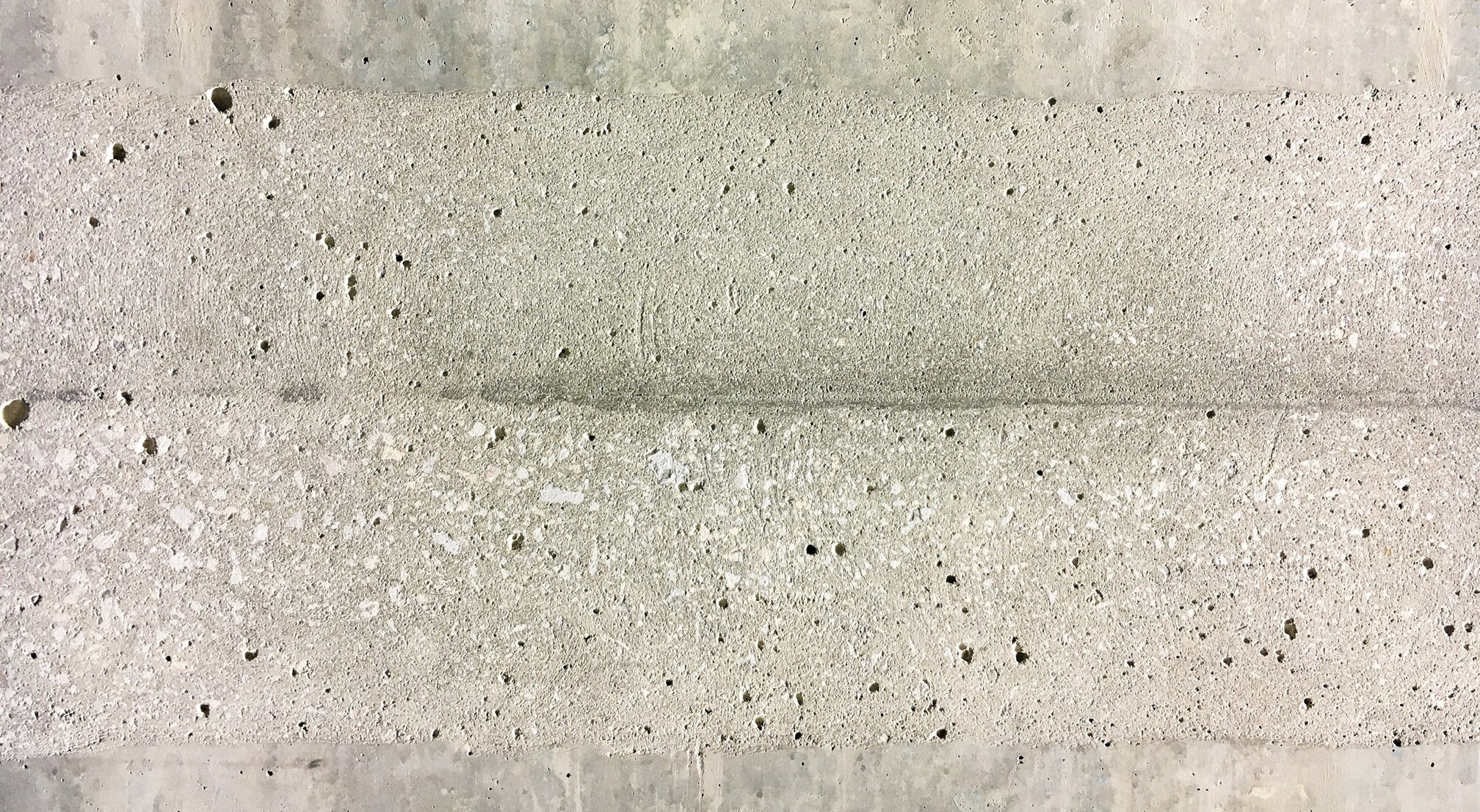 What are surface voids in concrete?